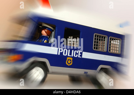 Plastic toy police van emergency concept service Stock Photo - Alamy