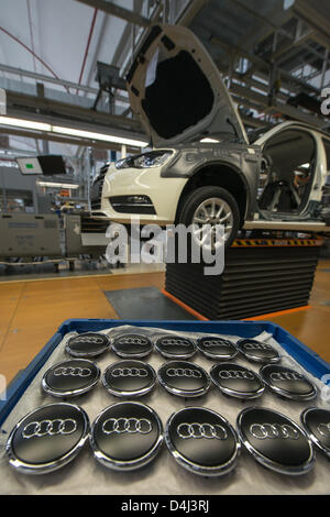 Audi emblems are ready to be mounted onto Audi A3's on the production ...