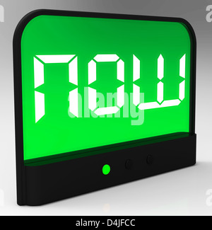 Now Clock Shows Quick Urgency For Action Stock Photo - Alamy