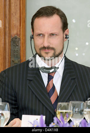 Crown Prince Haakon of Norway listens to Minnesota Governor Tim Walz ...