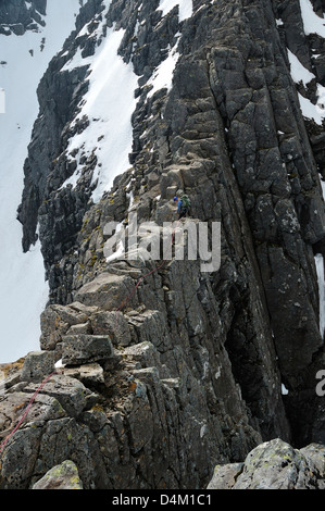 Climber on Tower Ridge, Ben Nevis, a classic route. She is near the ...