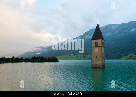 bell tower of the submerged church in the lake of resia in trentino ...