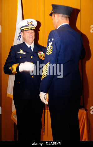 Coast Guard Eighth District Chief of Staff Capt. John Reed frocks the ...