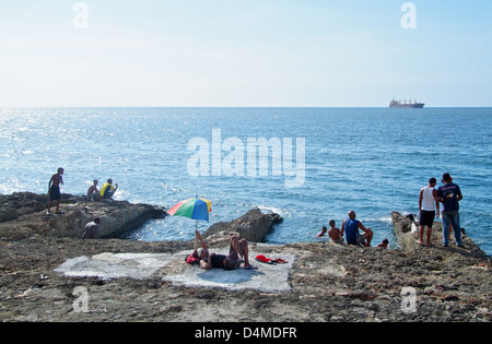 Cuban boys swimming at the Malecon Stock Photo: 4354757 - Alamy