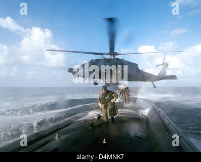 Members of the US Navy SEALs practice water insertion techniques in ...