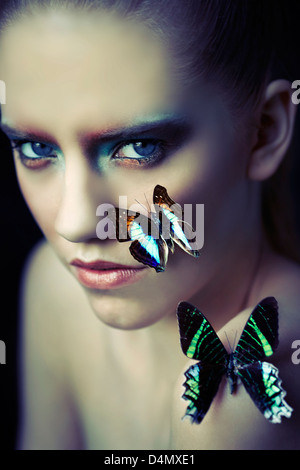 A young white woman with real butterflies on her face Stock Photo - Alamy