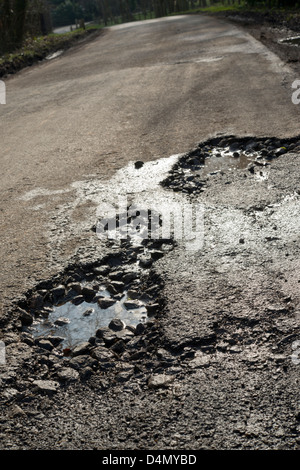 Frost damage, potholes in the road surface, Germany Stock Photo - Alamy