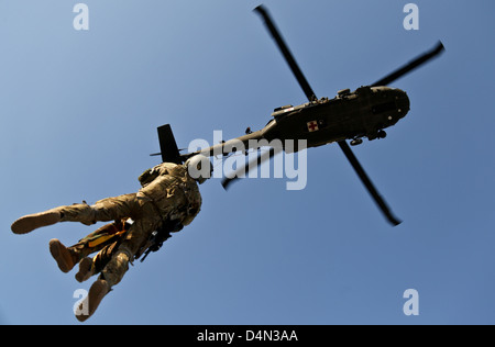 An Afghan National Army (ANA) commando, right, conducts a key leader ...