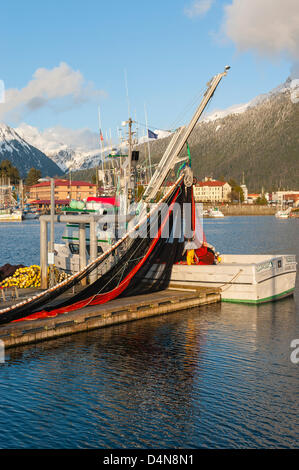Pacific herring purse seine net and lead line on stack on fishing boat ...
