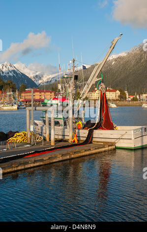Pacific herring purse seine net and lead line on stack on fishing boat ...