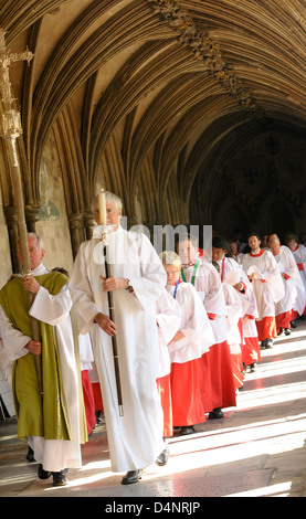 Choirboys in red cassocks and white ruffs holding music and singing at ...