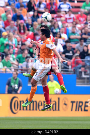 Houston Dynamo forward Brian Ching takes a shot during MLS soccer ...