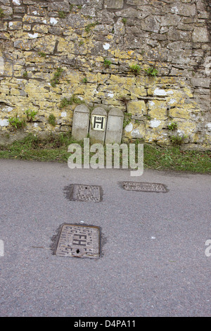 Concrete fire hydrant marker post in England Stock Photo - Alamy