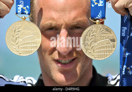 German open water swimmer Thomas Lurz poses with his two gold medals in ...
