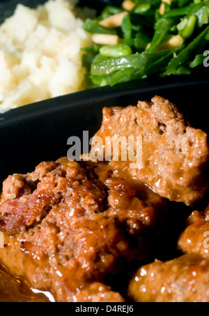 Cooked green beans with almonds in bowl on wooden table, top view Stock ...