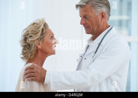 Bad Diagnosis. Doctor Lady Comforting Depressed Male Patient During ...