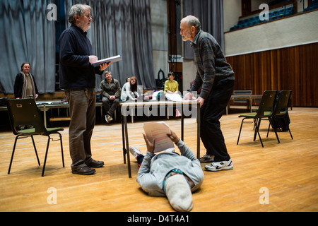 Actors holding their scripts rehearing a new play drama in a theatre ...