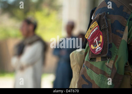 An Afghan National Army Commando maintains security during an Afghan ...