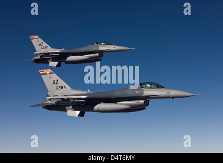 A pair of F-16's from the 162nd Fighter Wing fly in formation during a ...
