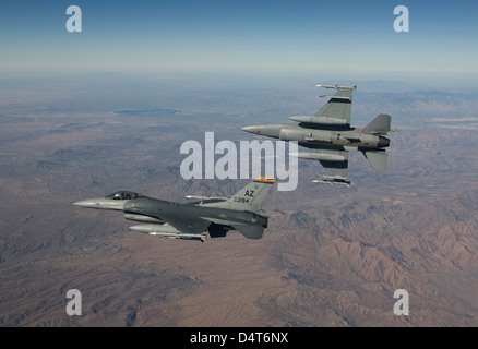 A pair of F-16's from the 162nd Fighter Wing fly in formation during a ...
