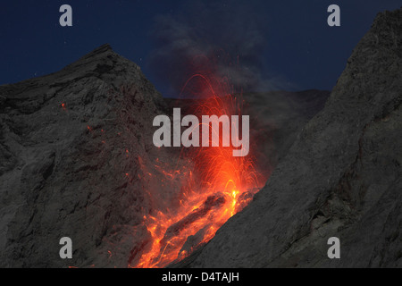 Strombolian type eruption of Batu Tara volcano, Indonesia Stock Photo ...