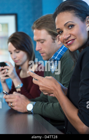 Business people using cell phones Stock Photo - Alamy