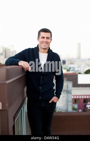 Man stands alone on balcony Stock Photo - Alamy