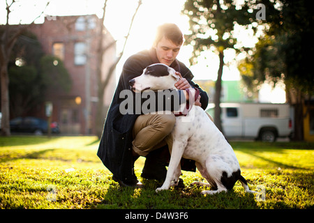 A man hugging his dog Stock Photo - Alamy