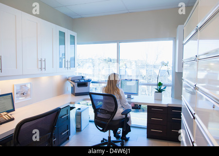 The businesswoman working in the office Stock Photo - Alamy