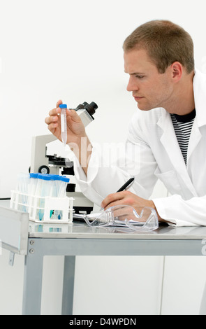 Young male technician working on computer in laboratory Stock Photo - Alamy