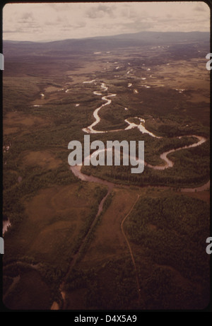 A photograph from August 1973 showing the Atigun River with a view ...