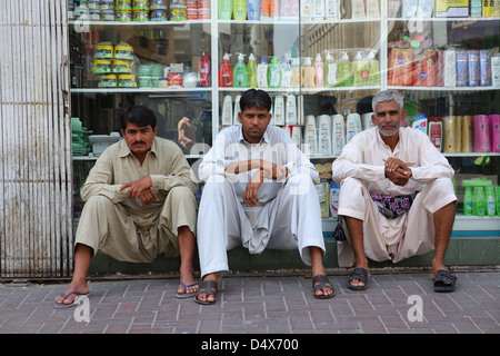 Three Arab men sitting in front of Kabyle house Stock Photo - Alamy