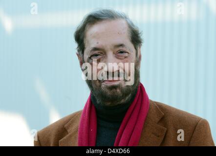 Indian writer Asit Datta poses with his book 'Armutszeugnis' (Lit ...