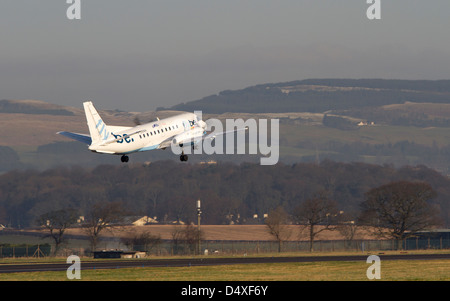 Flybe Saab 340 twin prop airplane takes of from Glasgow airport Stock ...