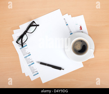 Coffee cup over a paper notebook on a table Stock Photo - Alamy