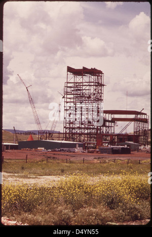In June 1973, a power plant was under construction next to spoil piles ...
