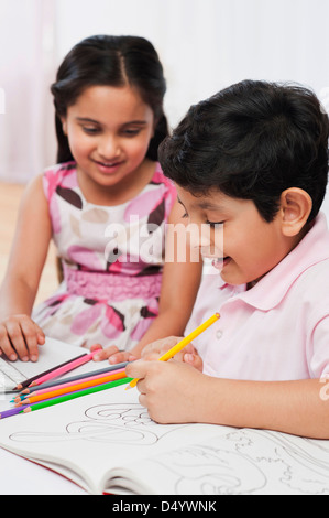 Children making drawings with colored pencils Stock Photo - Alamy