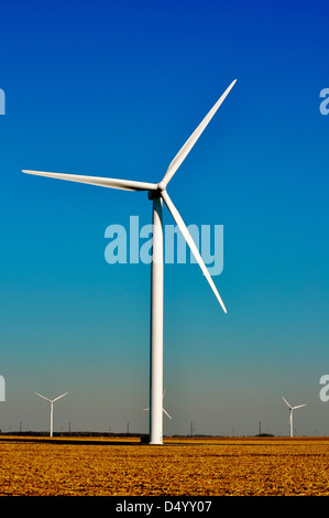 A windmill farm rotates over a Northwestern Indiana farm field Stock ...