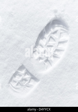 Boot footstep on snow Stock Photo - Alamy