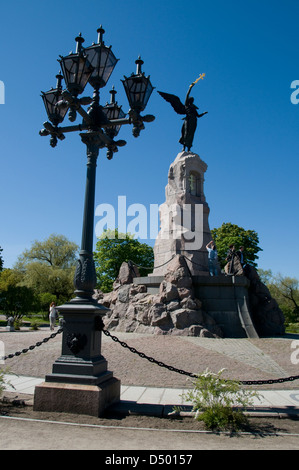 A bronze statue of an angel holding an Orthodox cross on the Russalka ...