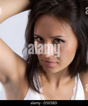 Young beautiful woman showing armpit with smooth clean skin on white background, closeup Stock ...
