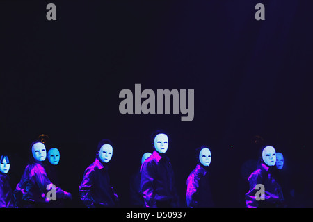 Group of dancers wearing masks Stock Photo - Alamy