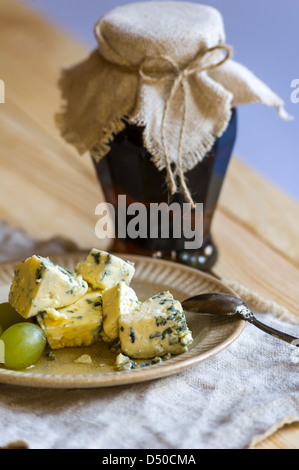 String cheese on rustic wooden board over white wooden background, low ...