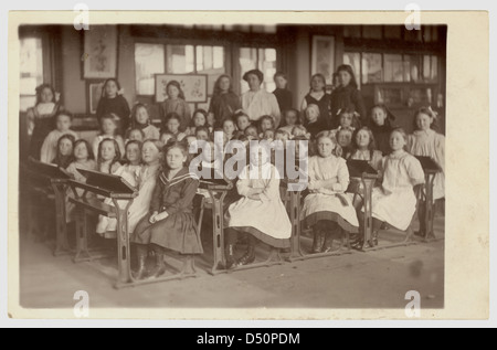 Edwardian infant children in a primary school classroom circa 1910 ...