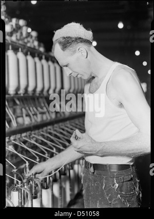 This photograph from January 1937 by Lewis Hine shows a woman working ...