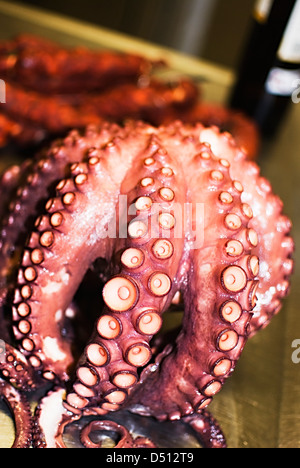 octopus cooked and presented in the table with accessories Stock Photo ...