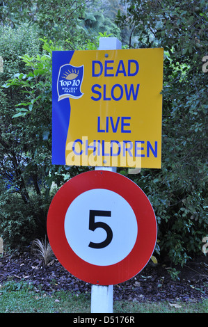 Dead slow, live children speed warning sign Stock Photo - Alamy