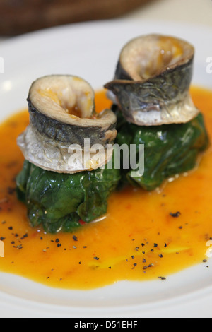 Chard leaf balls with fish fillet Stock Photo - Alamy