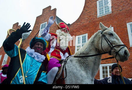 The Dutch version of Santa Claus, Sinterklaas, stands on the christmas ...
