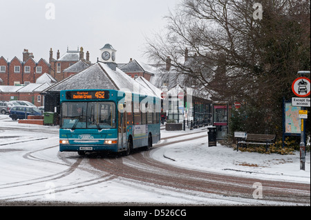 Arriva buses at Sevenoaks Bus Station, Kent UK during falling snow ...